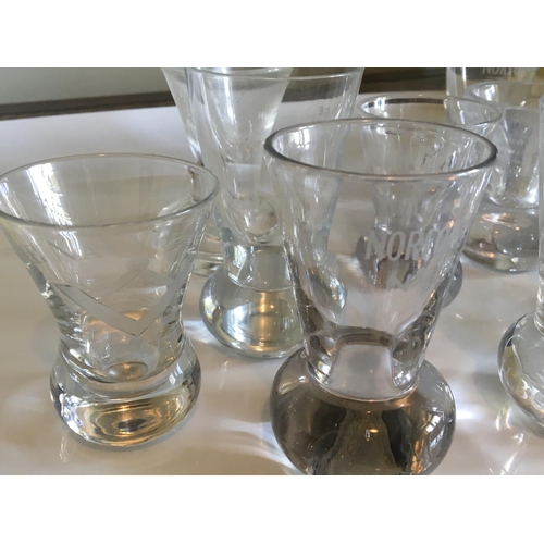 A collection of Masonic shot firing glasses. Including etched examples ...