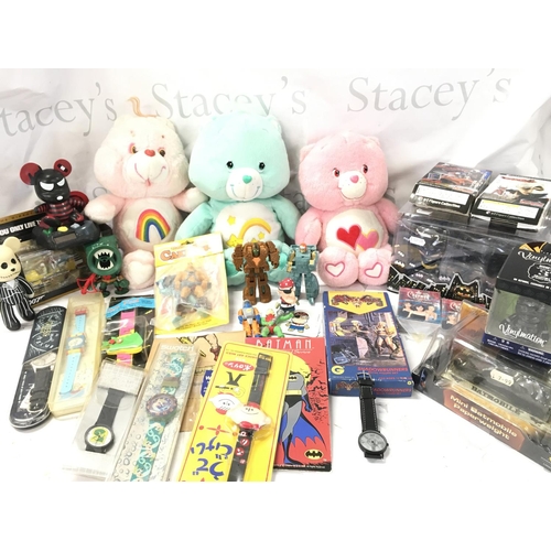 A Collection of Care Bears. Batman. Rock lords. Watches. Charmed ...