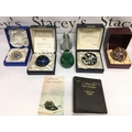 Six glass paperweights comprising g four boxed examples including two ...