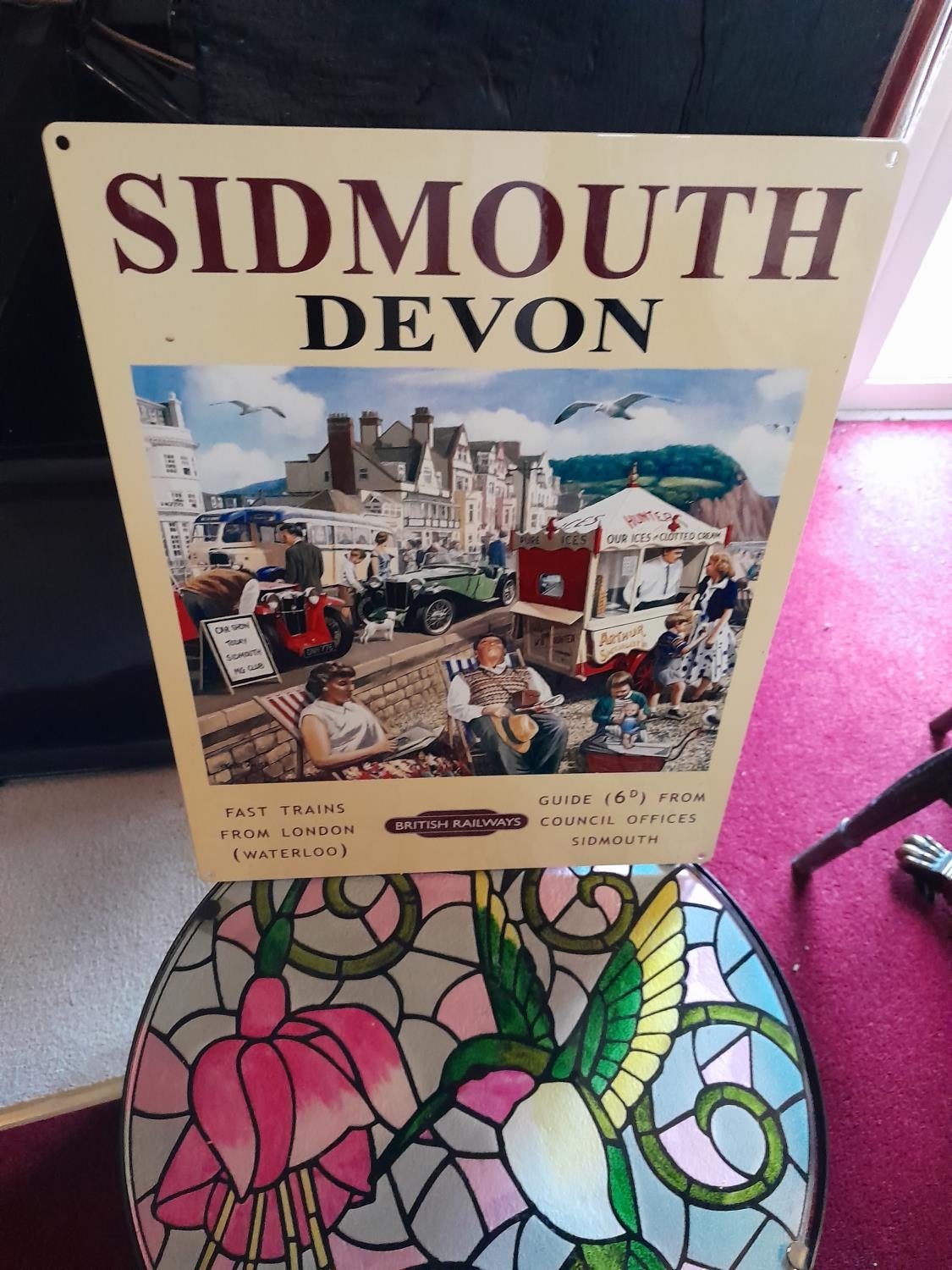 Assorted metal and other advertising signs and small folding table