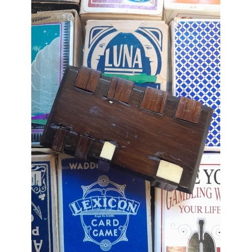 Collection of assorted era playing cards and whist marker, some packs ...
