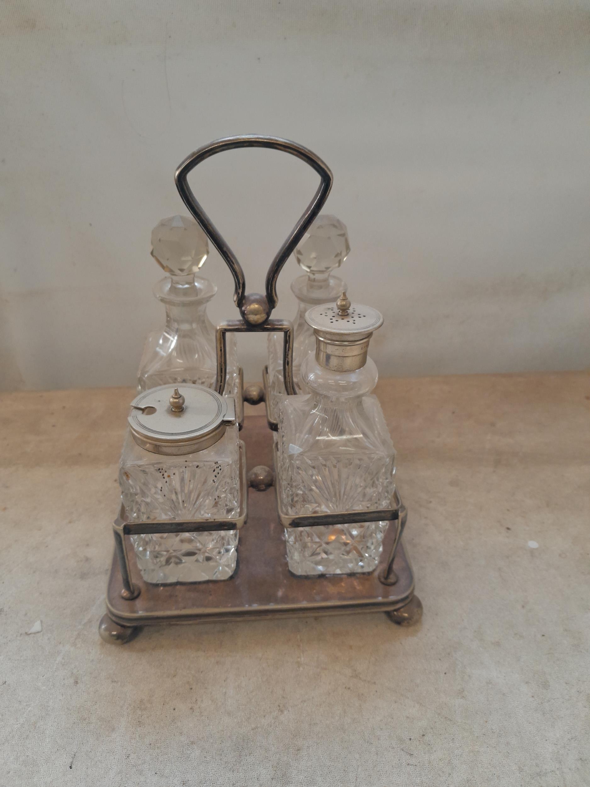 Silver plated table cruet stand with cut glass bottles