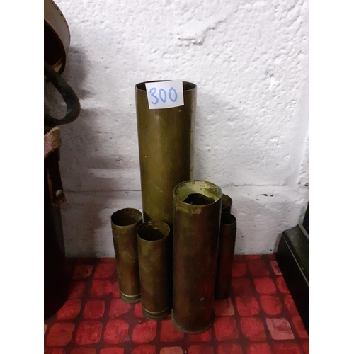 Six Varying Size Brass Shell Casings.