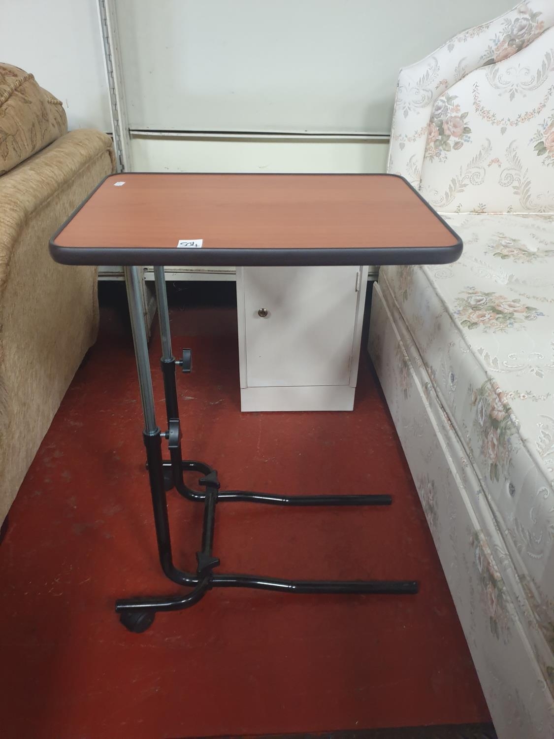 Adjustable Height Overbed Tray Table.