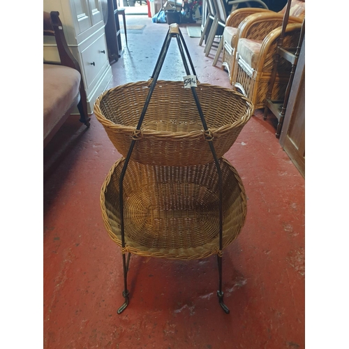 Wrought Iron Vegetable Rack with Two Wicker Baskets.