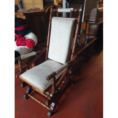 Cream Upholstered American Rocker.