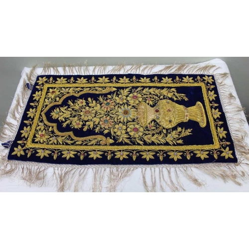 A Flowered Mehrab wall hanging in blue velvet, embroidered with gold ...