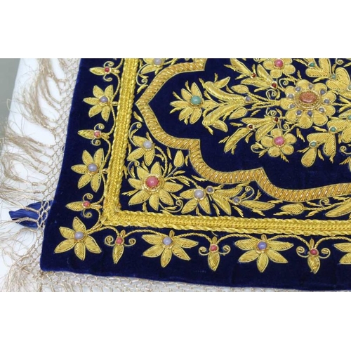 A Flowered Mehrab wall hanging in blue velvet, embroidered with gold ...