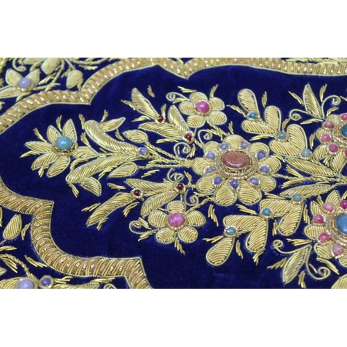 A Flowered Mehrab wall hanging in blue velvet, embroidered with gold ...