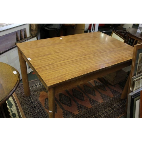 A melamine rectangular topped extending table