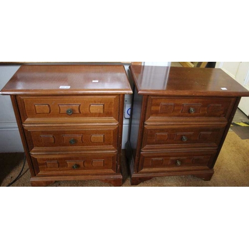 A pair of modern three drawer bedside chests.