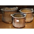 A set of three graduated cooking pots