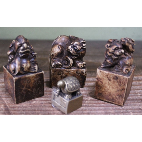 Three old Chinese stone chops/seals with detailed bases and engraved ...