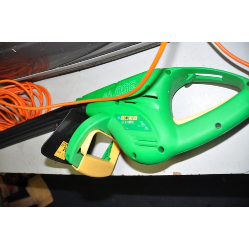 A FLYMO VISION COMPACT 380 LAWN MOWER and a NuTool Hedge Trimmer (both ...