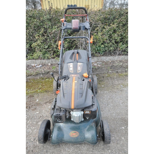 A BMC LAWNRACER 20ESi SELF PROPELLED PETROL LAWN MOWER with a Wolf ...