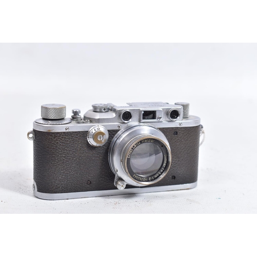A 1938 LEICA lllA RANGEFINDER CAMERA with a Summar 5cm f2 lens( very ...