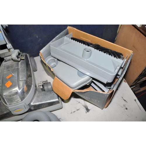 A KIRBY G7E ULTIMATE VACUUM CLEANER along with a large selection of ...