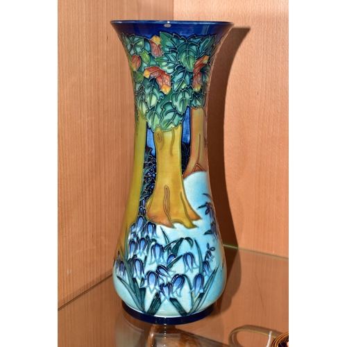 A MOORCROFT POTTERY 'BLUEBELL WOOD' VASE, of tall waisted form, tube ...