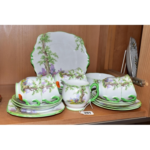 A ROYAL ALBERT 'GREENWOOD TREE' PATTERN TEA SET, comprising a bread and ...