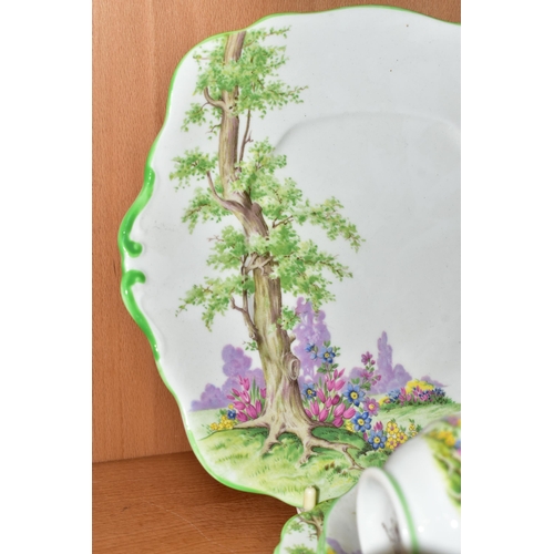 A ROYAL ALBERT 'GREENWOOD TREE' PATTERN TEA SET, comprising a bread and ...