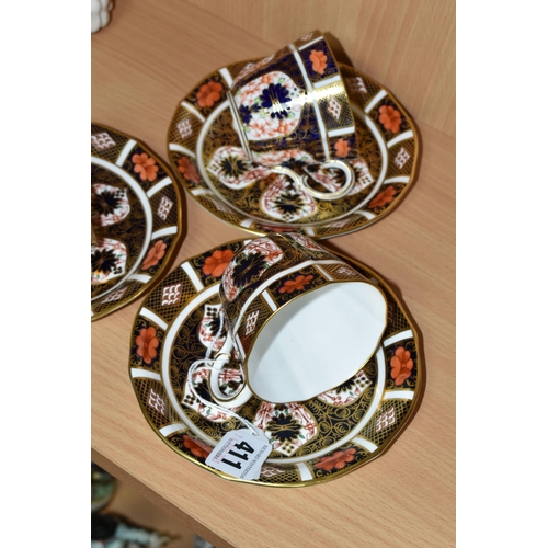 THREE ROYAL CROWN DERBY IMARI 1128 TEACUPS AND SAUCERS, having red ...