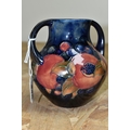 A MOORCROFT POTTERY POMEGRANATE TWIN HANDLED VASE, of amphora style ...