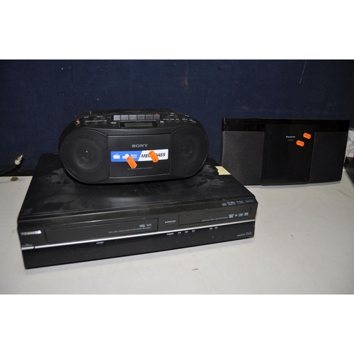 A PANASONIC SC-HC297 COMPACT STEREO SYSTEM with remote, along with a ...