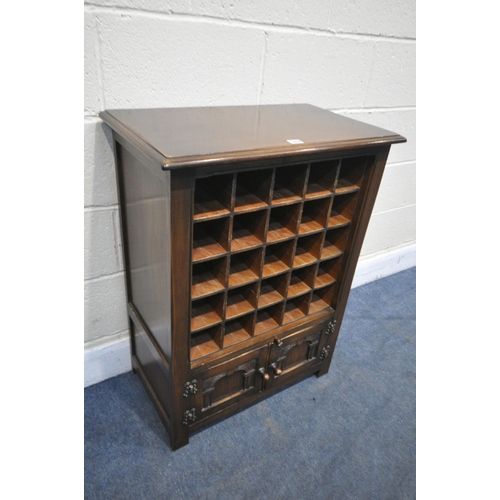 A BEVAN FUNNEL REPRODUX OAK 25 HOLE WINE CABINET, with double cupboard ...