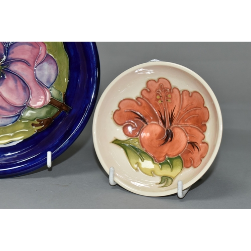 TWO MOORCROFT POTTERY BOWLS, comprising a small footed bowl, decorated ...