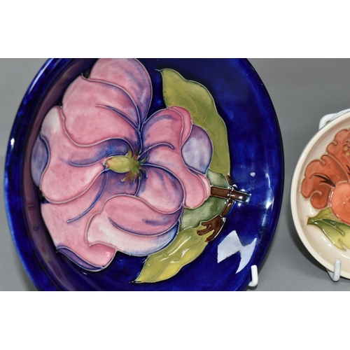 TWO MOORCROFT POTTERY BOWLS, comprising a small footed bowl, decorated ...