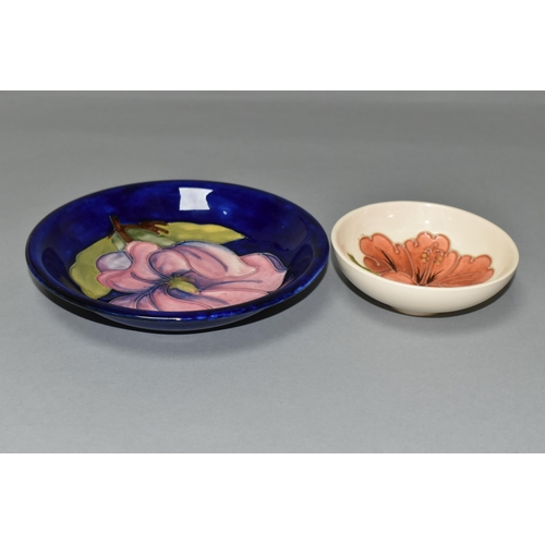 TWO MOORCROFT POTTERY BOWLS, comprising a small footed bowl, decorated ...