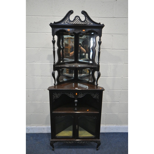 AN EDWARDIAN MAHOGANY OPEN CORNER UNIT, with an arrangement of mirrors ...