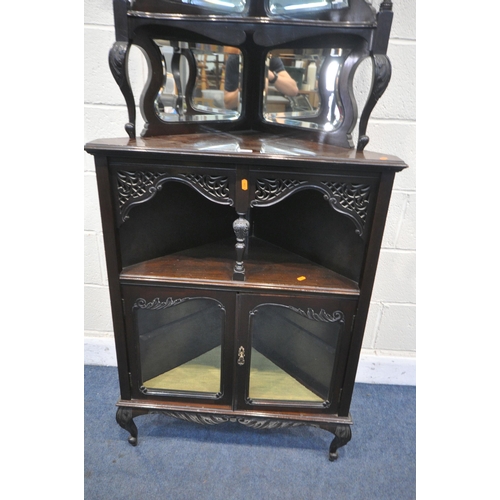 AN EDWARDIAN MAHOGANY OPEN CORNER UNIT, with an arrangement of mirrors ...