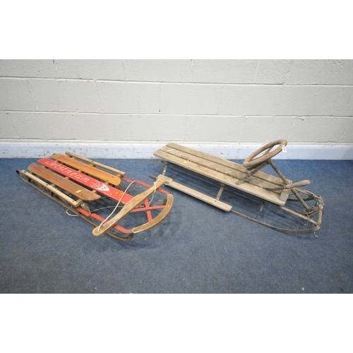 A VINTAGE WOODEN AND METAL SLEDGE, with steering and brakes, along with ...