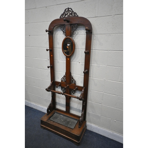 A VICTORIAN WALNUT AND OAK HALL STAND, with open fretwork detail, an ...