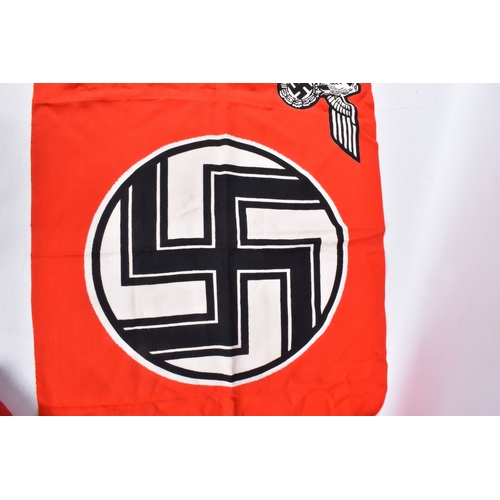 TWO GERMAN FLAGS WITH SWASTIKA SYMBOLS, the first has a printed size ...