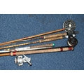 A GROUP OF FOUR VINTAGE FISHING RODS, to include a Shakespeare ...