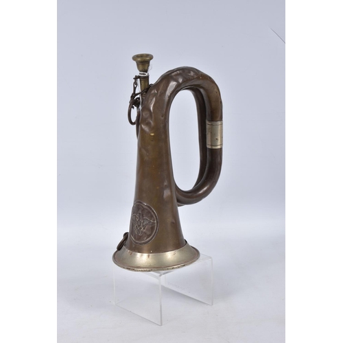 A GERMAN MILITARY BUGLE COMPLETE WITH BADGE, this is complete with ...