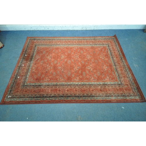 A RECTANGULAR BELGIAN ROYAL KESHAN HERATI RED GROUND WOOLLEN RUG, with ...