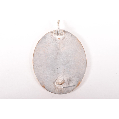 A GERMAN GESTAPO WARRANT DISC WOUND BADGE AND THREE OTHER ITEMS, the ...
