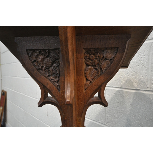 A 20TH CENTURY OAK LECTERN, with shaped supports, raised on a hexagonal ...