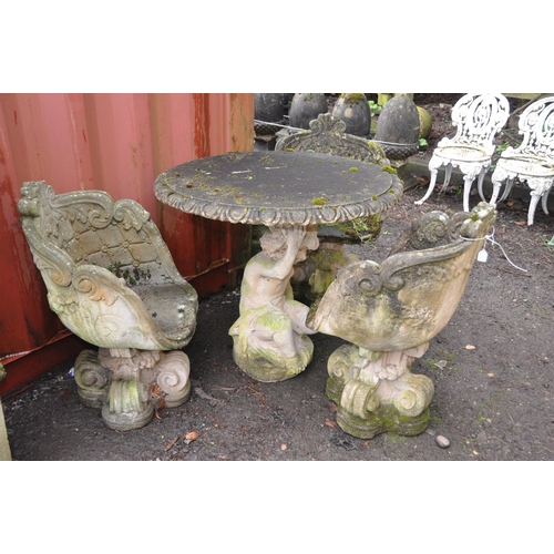 A WEATHERED COMPOSITE GARDEN TABLE AND THREE SIMILAR CHAIRS, the table ...