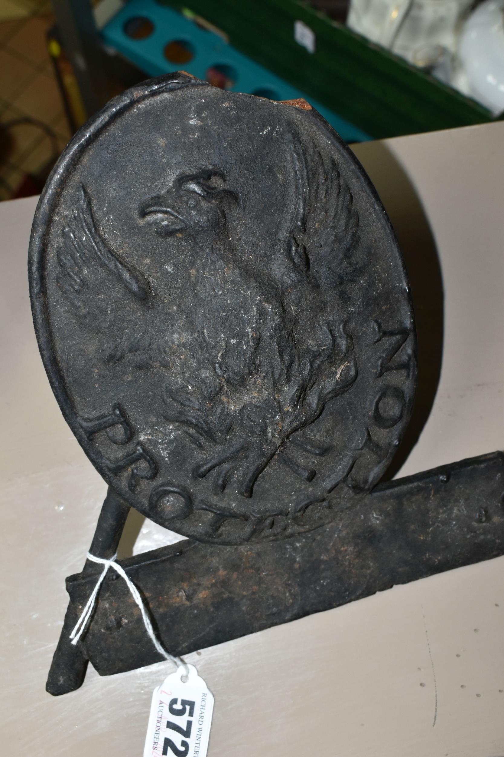 A CAST IRON FIREMARK, plaque image of a Phoenix with the word ...