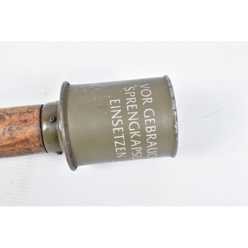 THREE INERT GERMAN STYLE STICK GRENADES, all three have wooden handles ...