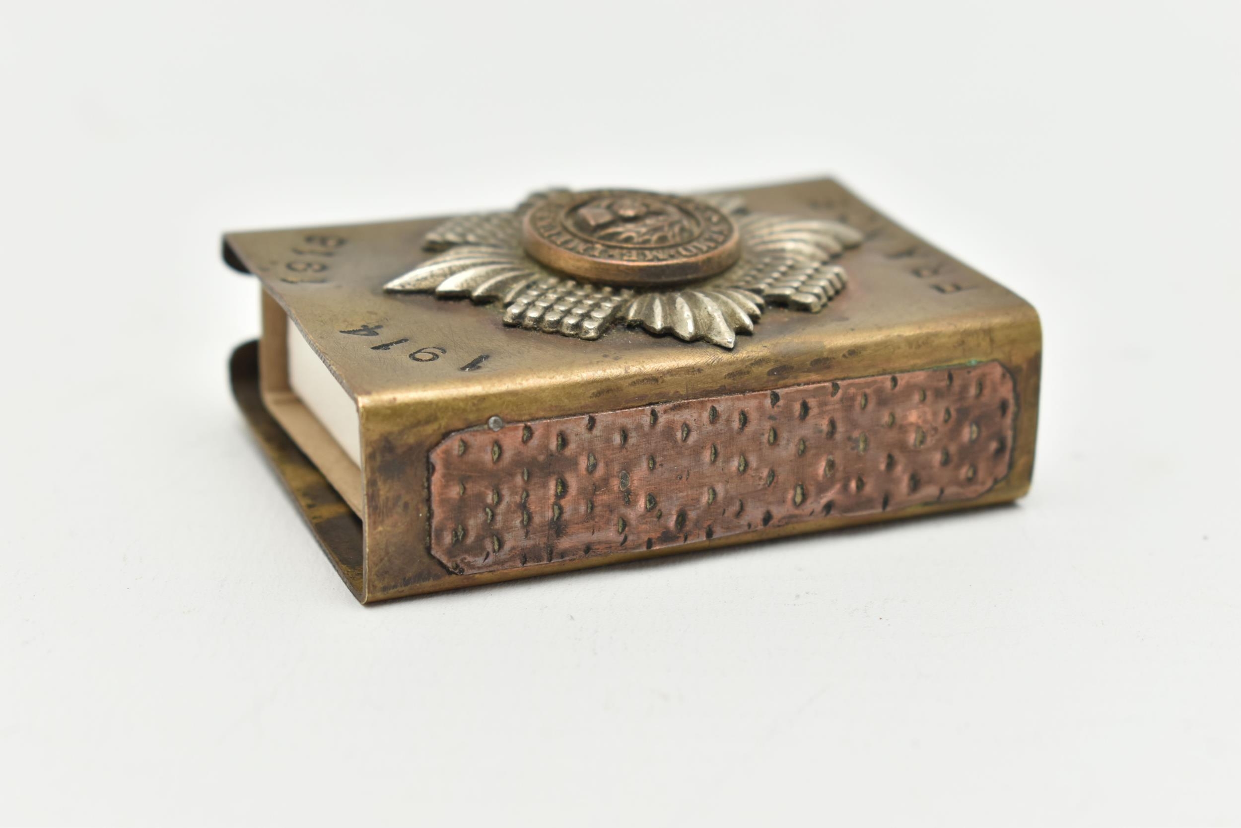 A WWI TRENCH ART BRASS MATCHBOX SLEEVE WITH SCOTS GUARD BADGE TO THE ...