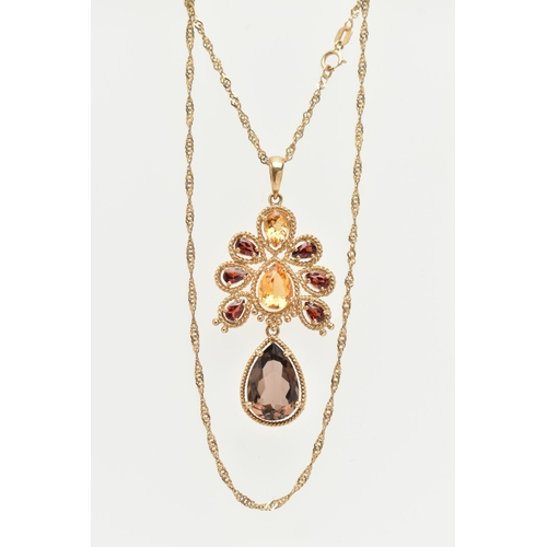 A 9CT GOLD GEM SET PENDANT NECKLACE, the large drop pendant set with a ...