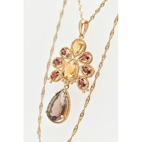 A 9CT GOLD GEM SET PENDANT NECKLACE, the large drop pendant set with a ...