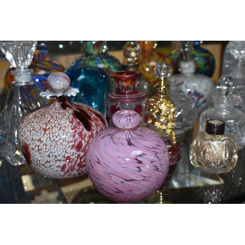 A GROUP OF SCENT BOTTLES, twenty one examples to include a pink and ...