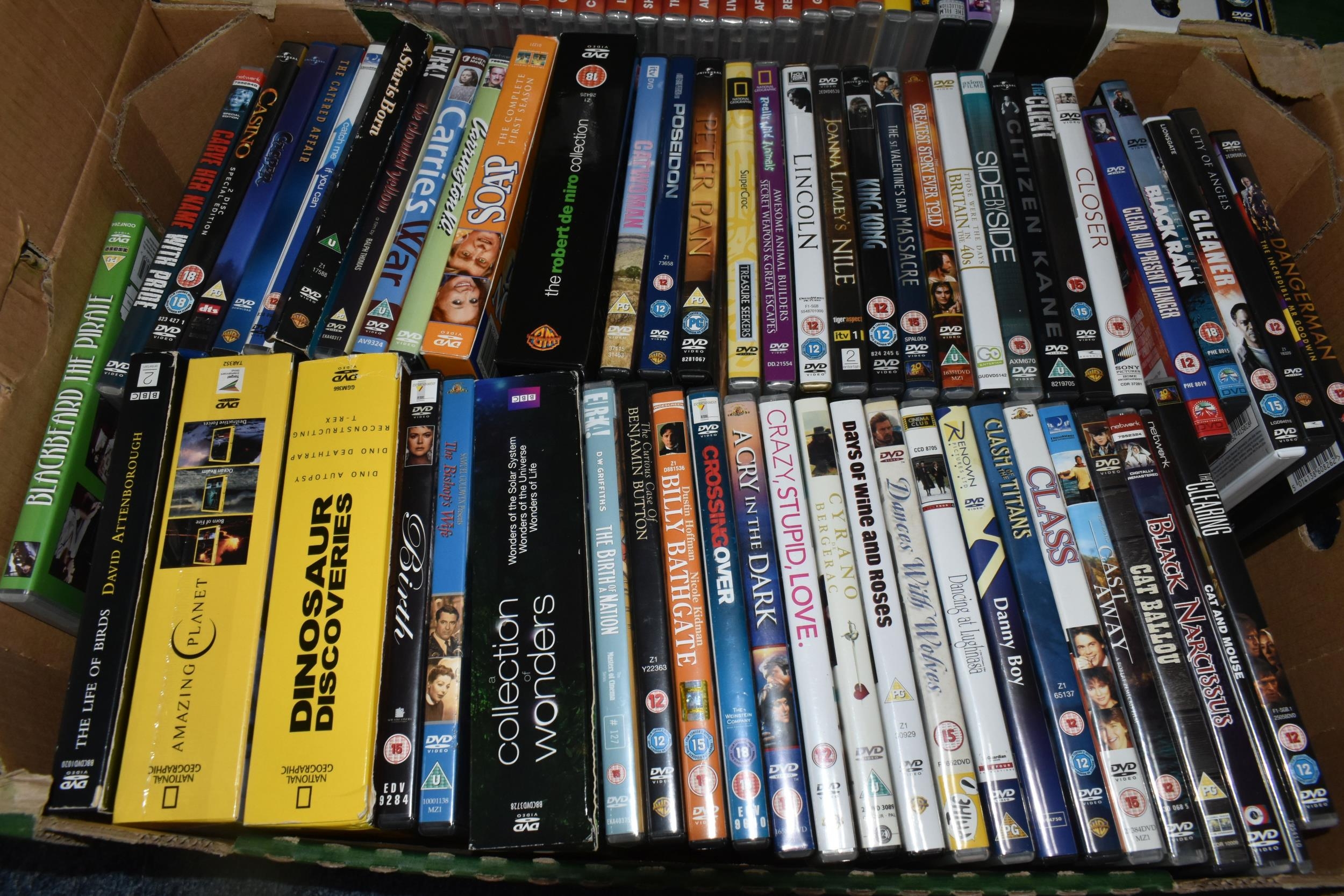 SIX BOXES OF PRE-RECORDED DVDS, mostly cinematic films to include ...