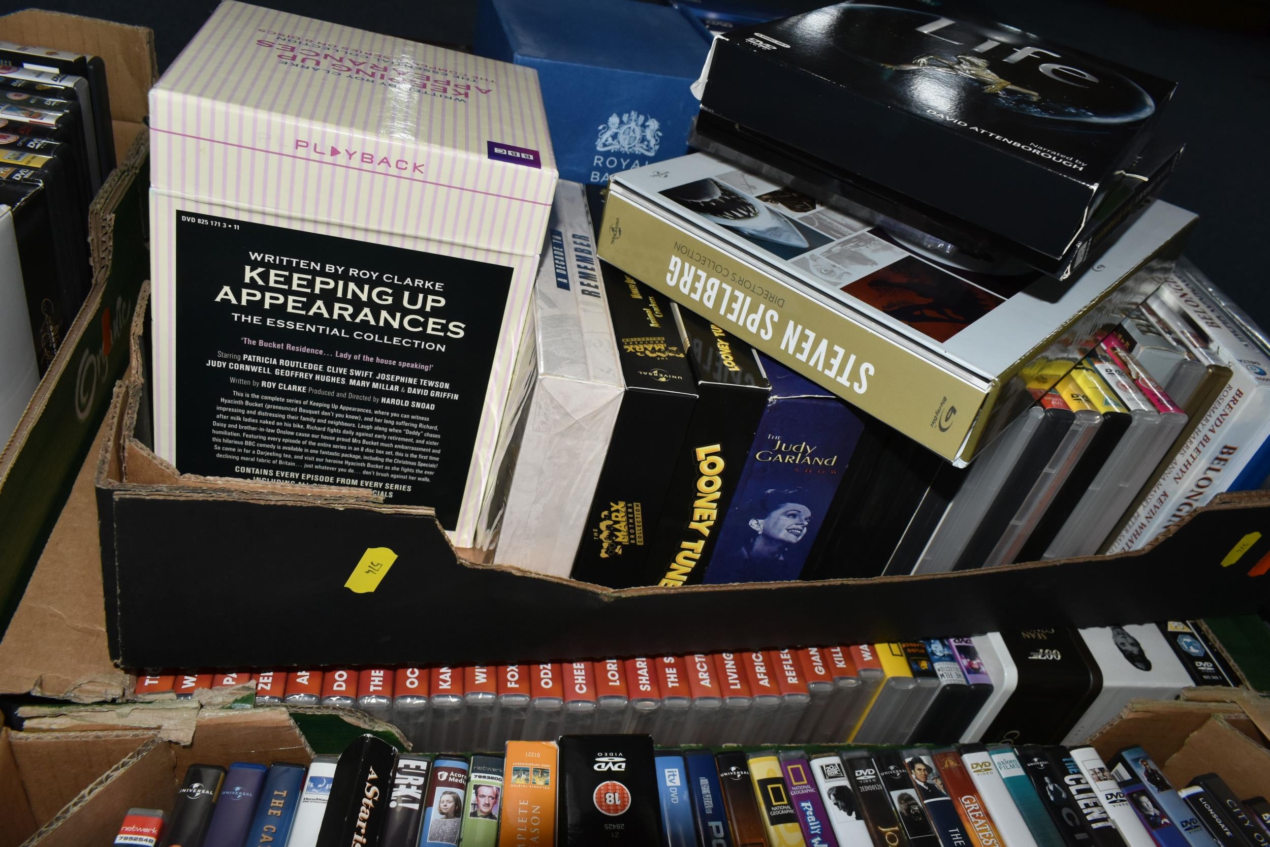 SIX BOXES OF PRE-RECORDED DVDS, mostly cinematic films to include ...